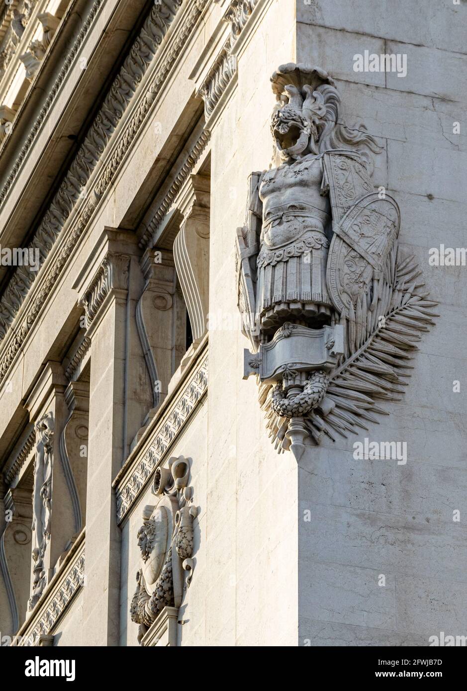 a view of roman armour etched in stone decorating one of the buildings ...