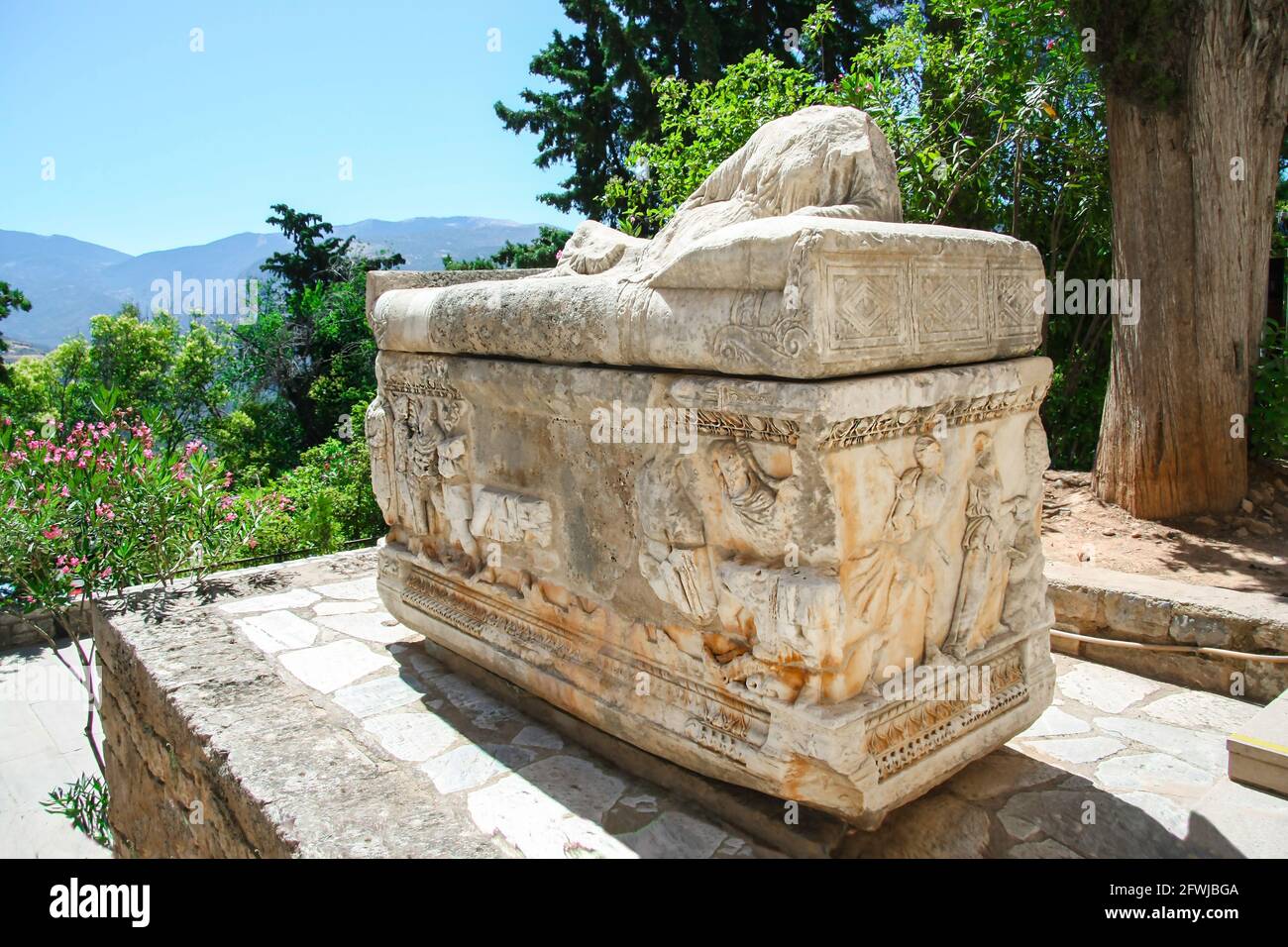 Delphi, ancient greek sarcophagus. Gravestone with a lying woman ...