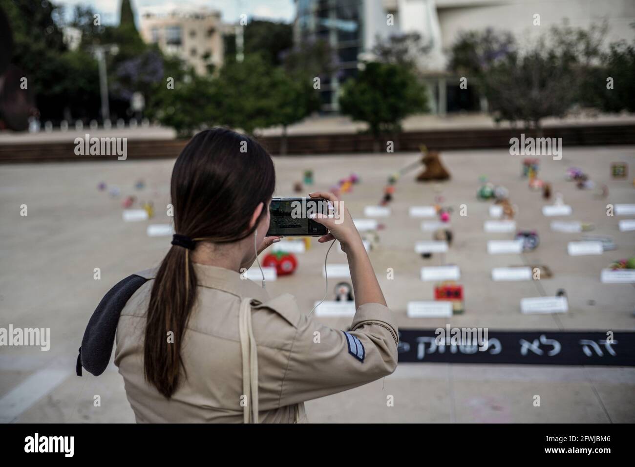 Tel Aviv, Israel. 23rd May, 2021. A soldier takes photos to the 67 ...