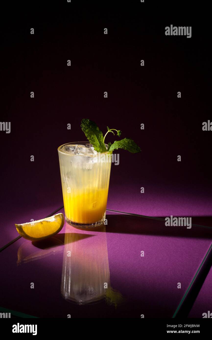 Orange Cocktail With Garnishes Stock Photo - Alamy