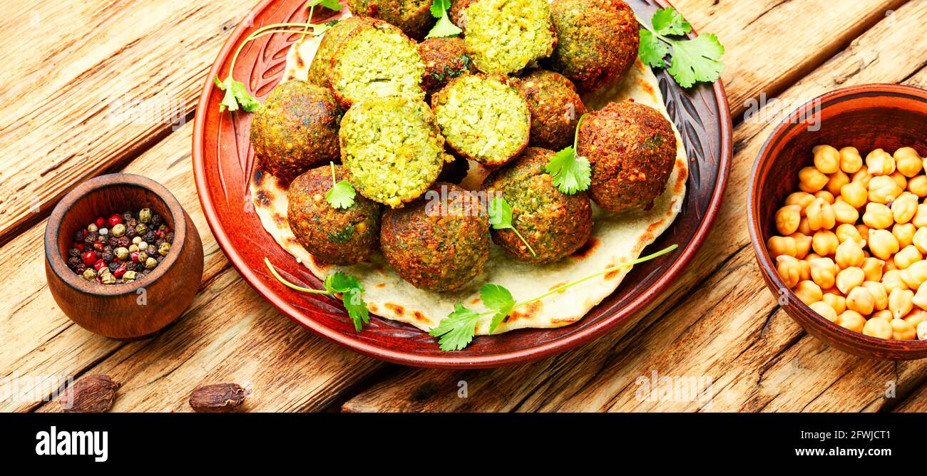 Falafel deep-fried balls made from chopped legumes or chickpeas Stock ...