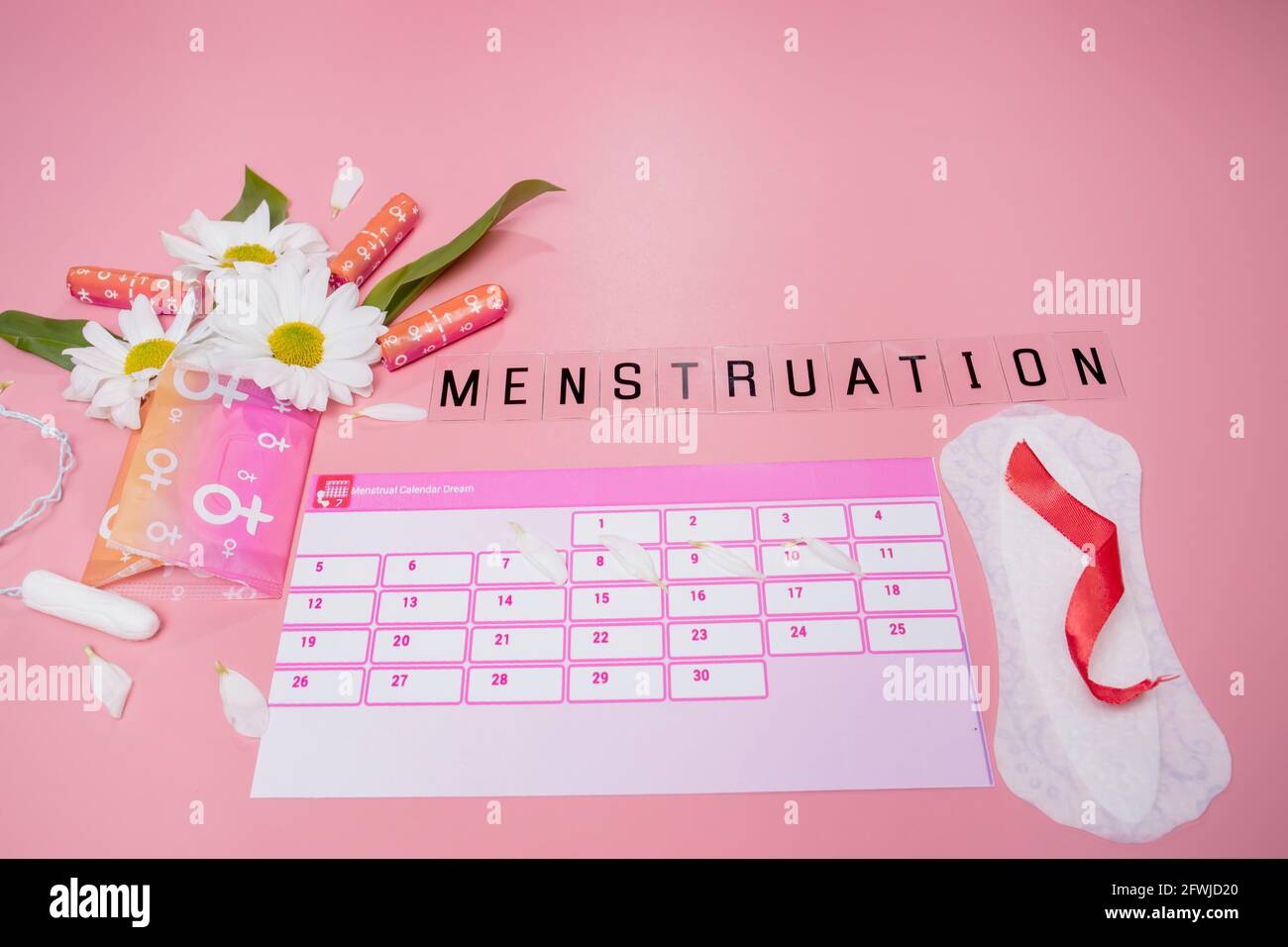 Menstruation calendar with cotton tampons , sanitary pads, white flower ...