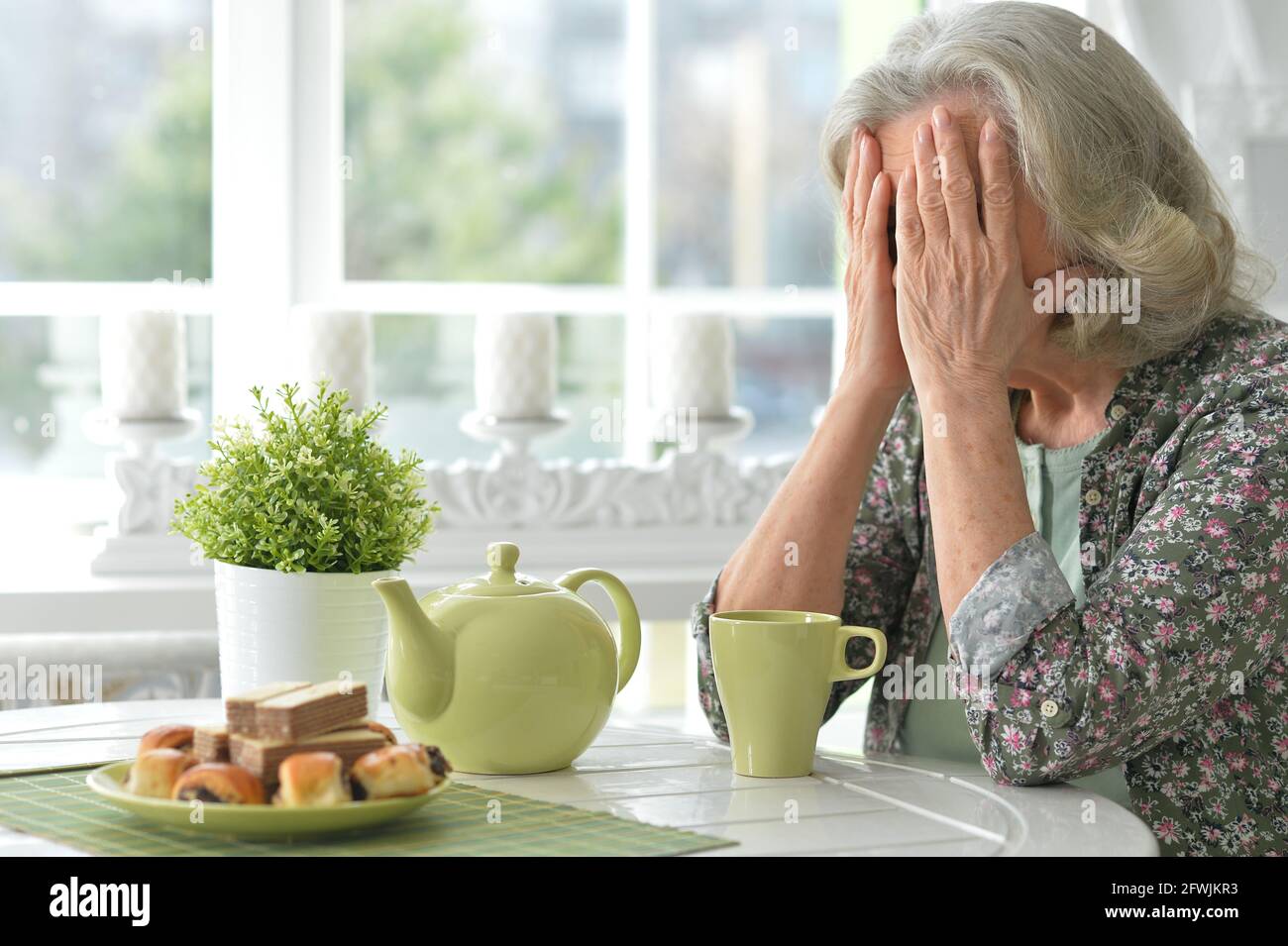 Sad adult woman drinking tea hi-res stock photography and images - Alamy