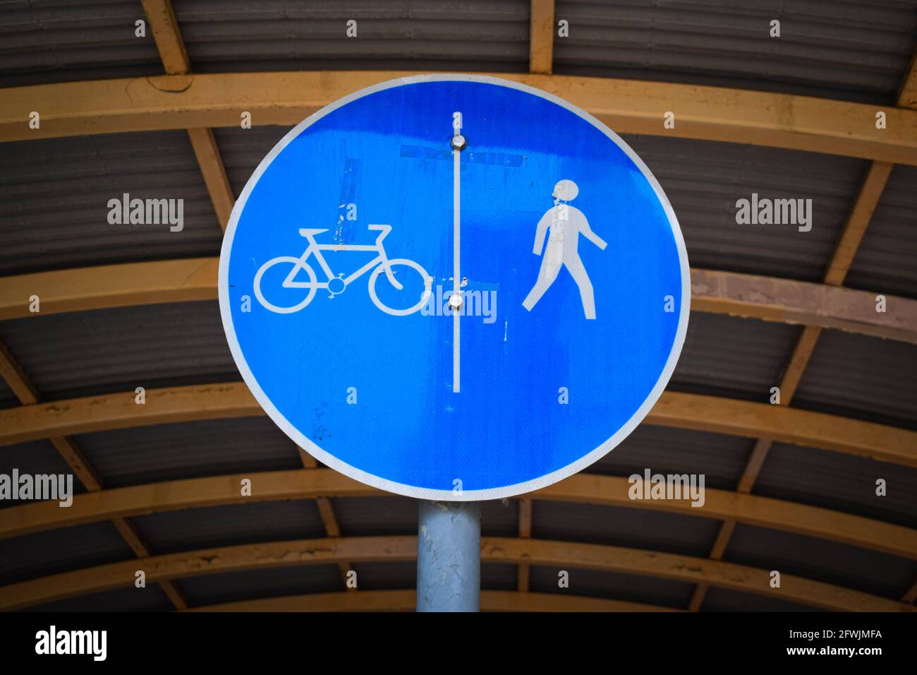 Blue road sign of bicycle path and pedestrian path Stock Photo - Alamy
