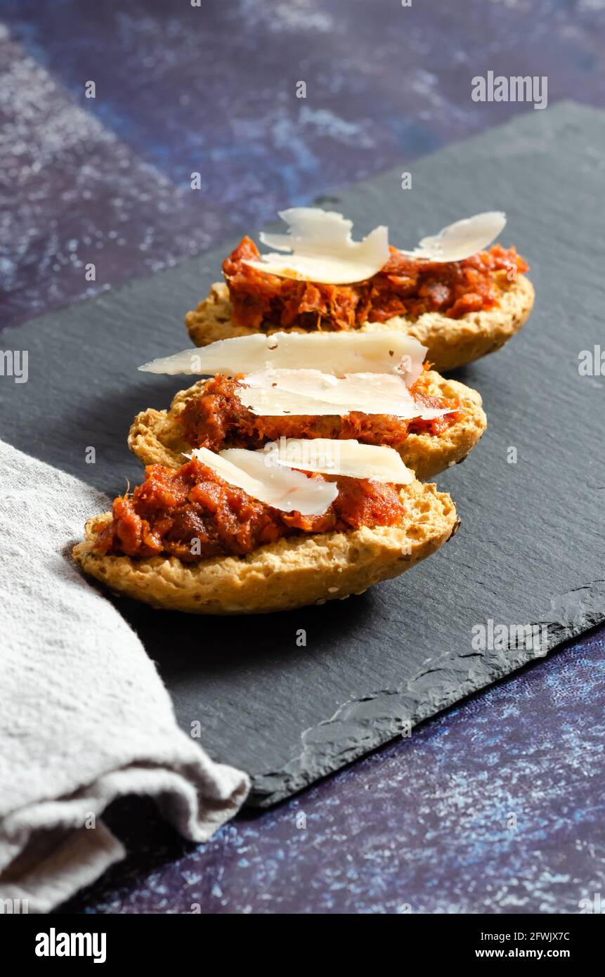 Three toasts with sobrasada and cheese Stock Photo - Alamy