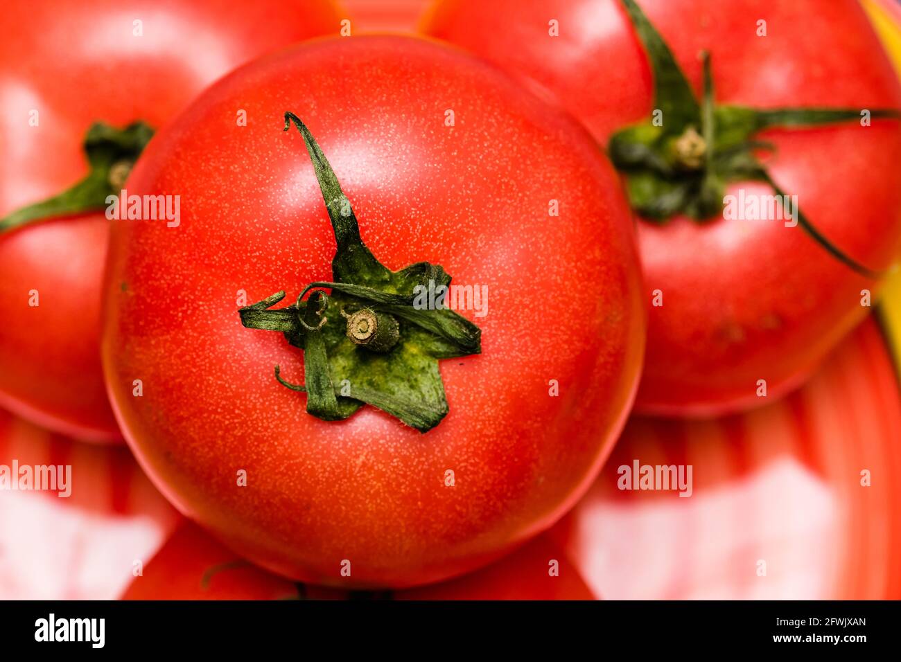Close up of ripe red tomato, tomatoes background Stock Photo - Alamy