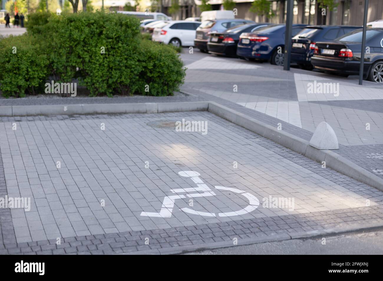 Cars parking with disability sign Stock Photo - Alamy
