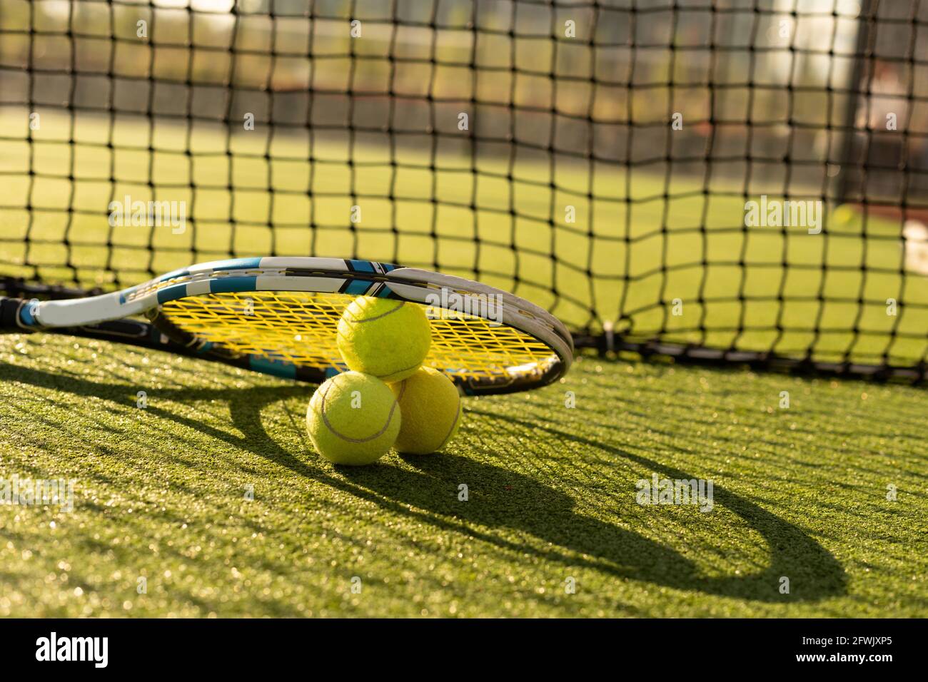 Close up view of two tennis rackets and balls on the tennis court Stock ...