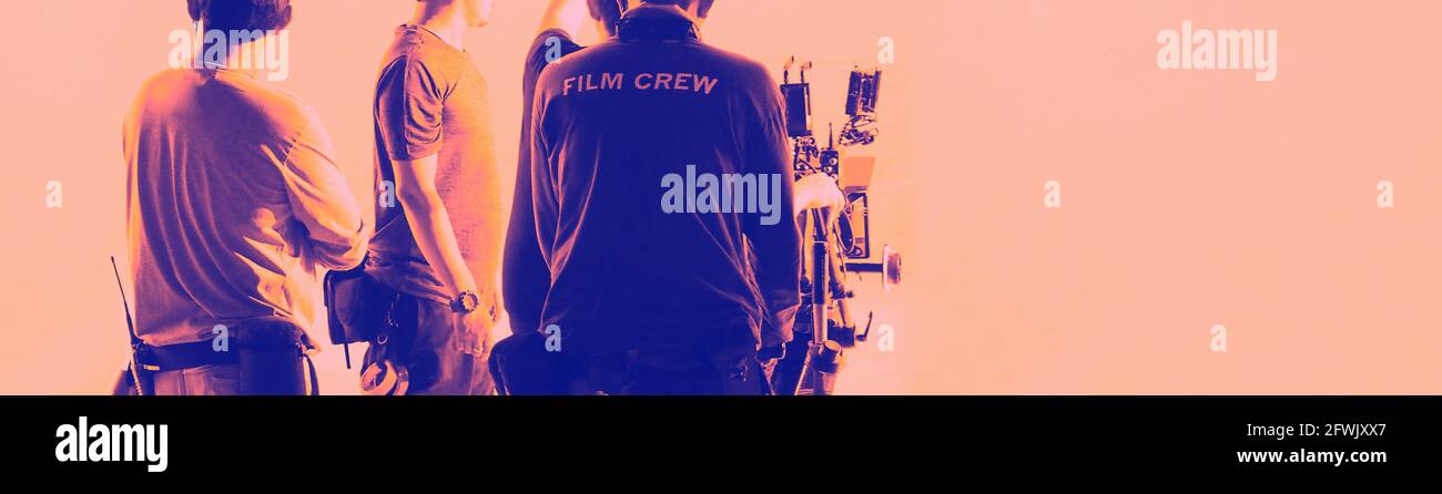 Film Production. Back of videoographer and film crew team with 4k high ...