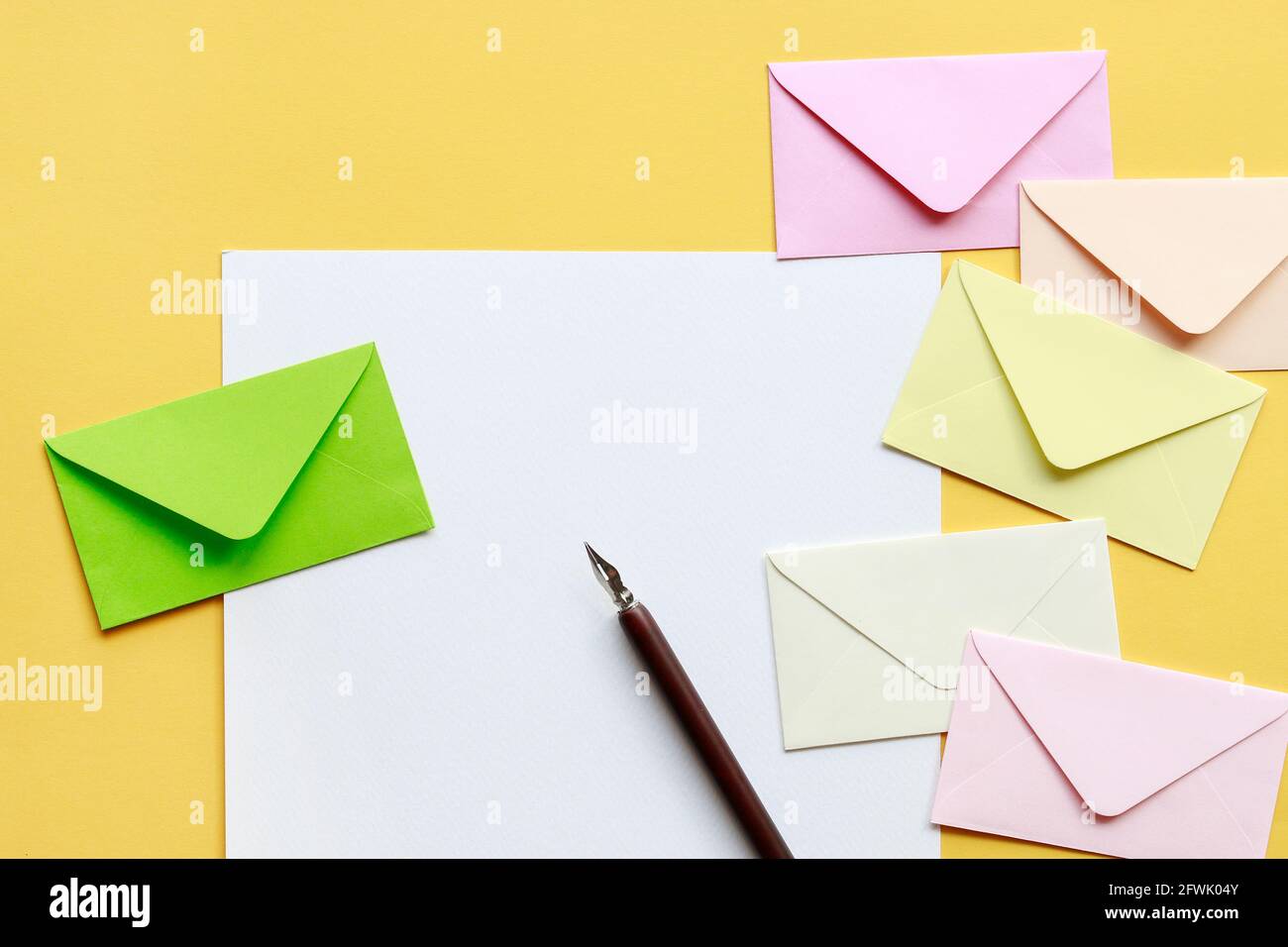 Colorful envelopes on yellow background, copy space Stock Photo - Alamy