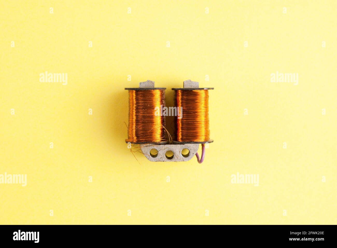 An electricity transformer on yellow background Stock Photo - Alamy