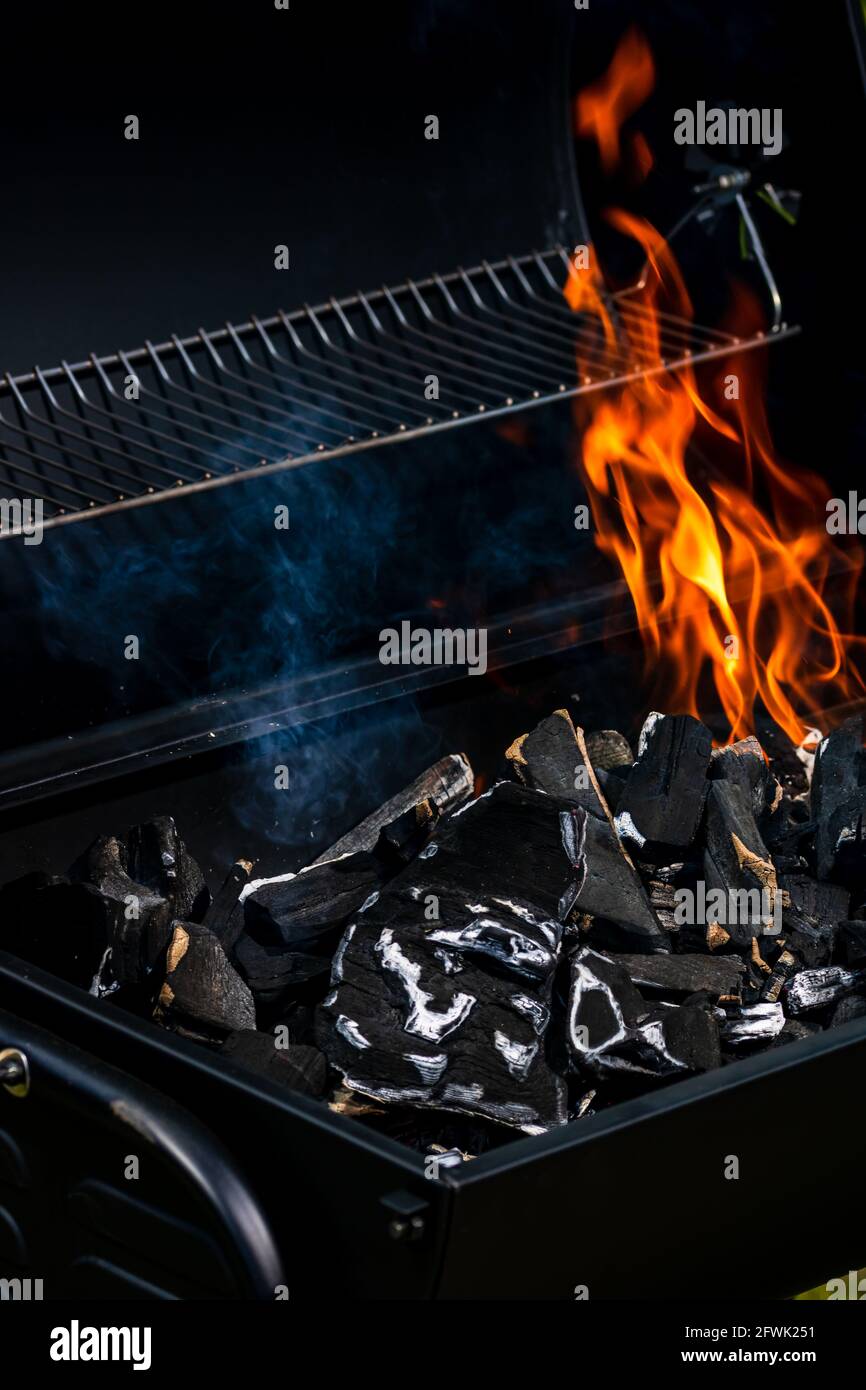 Barbecue grill pit with glowing and flaming hot open fire with red ...