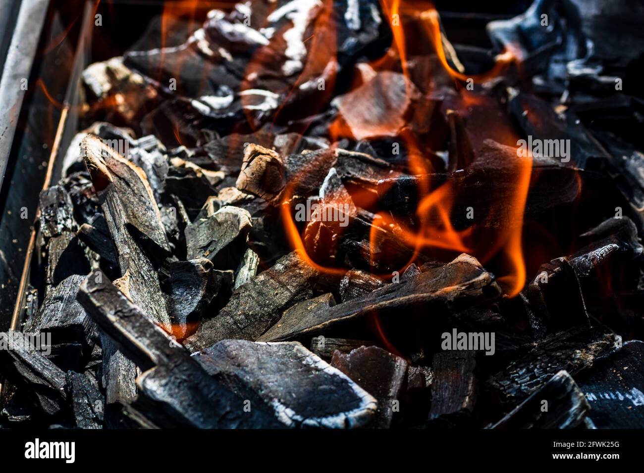 Barbecue grill pit with glowing and flaming hot open fire with red ...