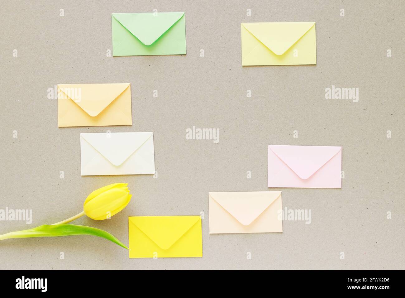 Colorful envelopes on grey paper background, copy space. Graphic ...