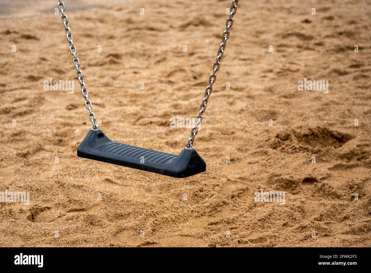 Empty swing on childrens playground hi-res stock photography and images ...
