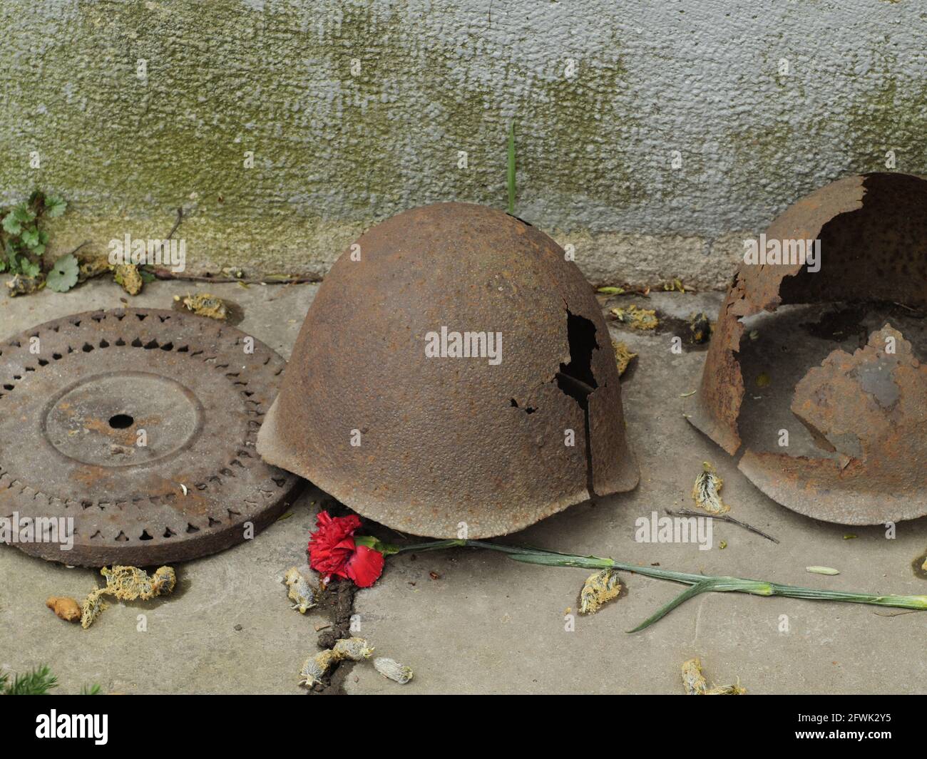 Old soldiers' iron helmets with holes traces of past battles on the ...