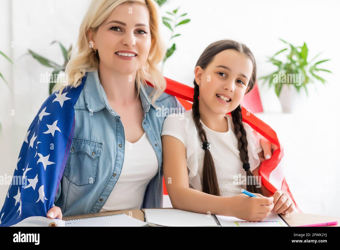 Young girl learning english with teacher Stock Photo - Alamy