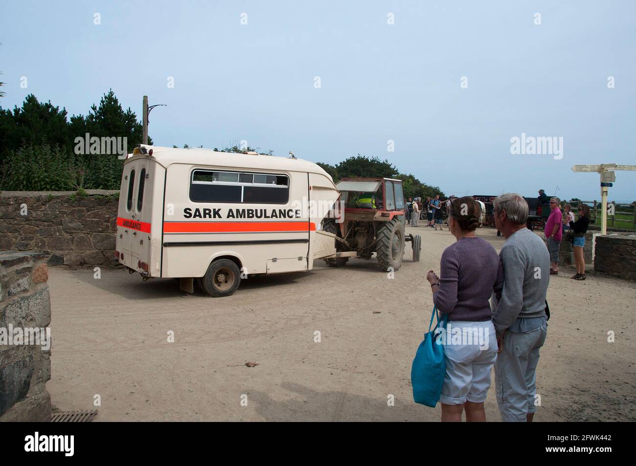 Sark ambulance trailer pulled by a tractor Stock Photo - Alamy