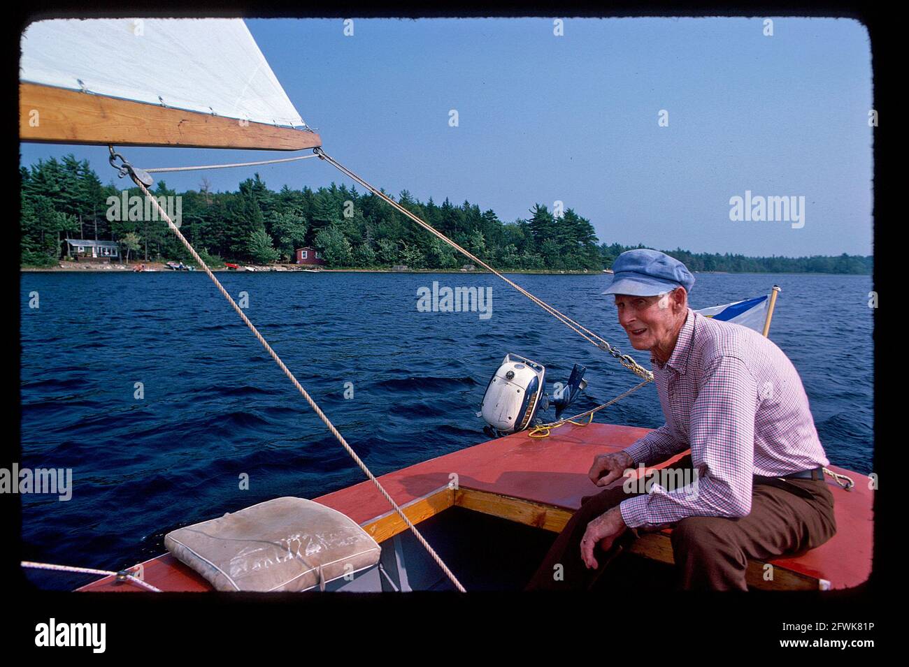 old sailor sailing a wooden sailboat 1977 Stock Photo - Alamy