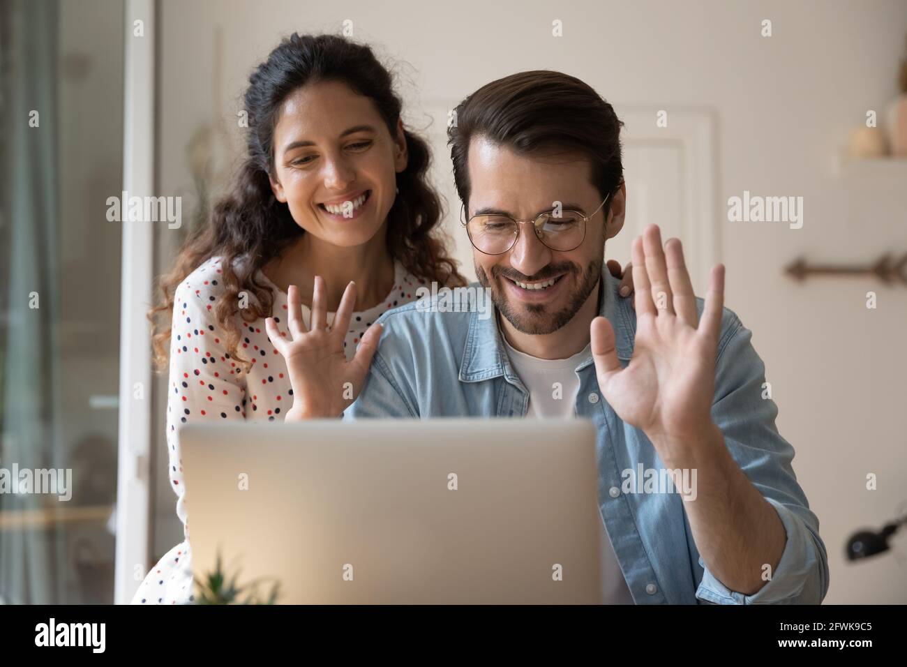 Happy family couple holding video call conversation Stock Photo - Alamy