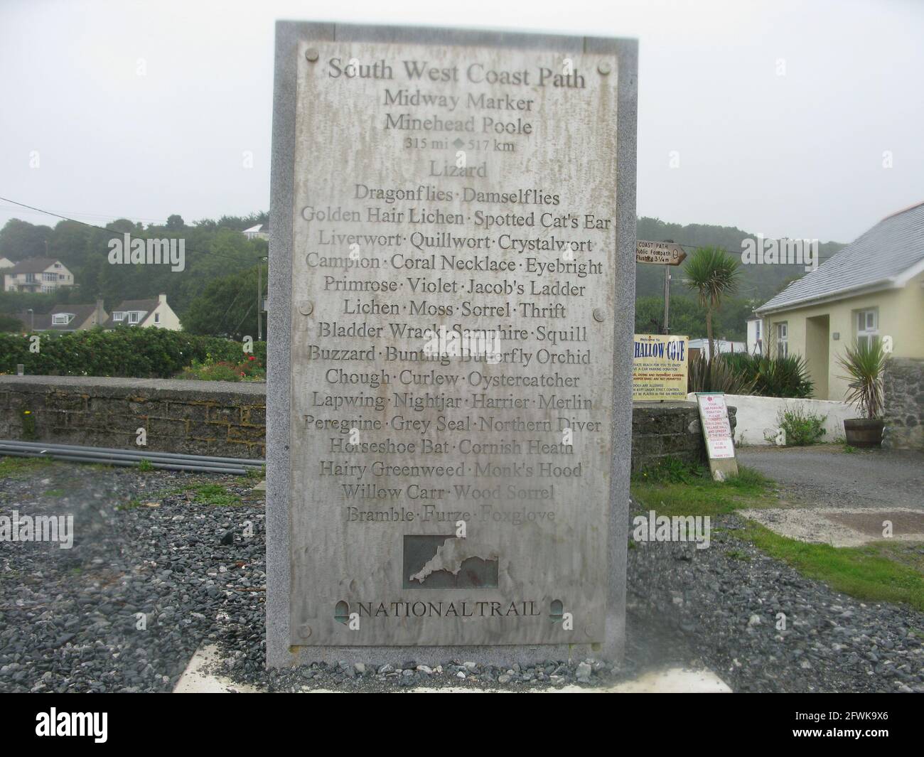 Porthallow village. South west coast path midway halfway point sign. Lizard peninsula. Cornwall ...