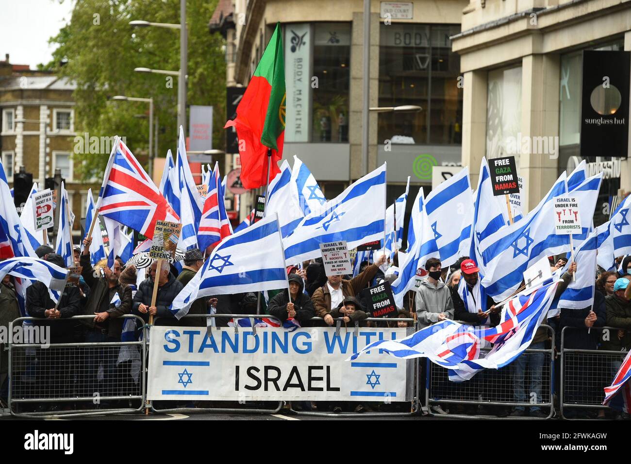 People take part in a pro-Israel rally adjacent to the Israeli embassy ...