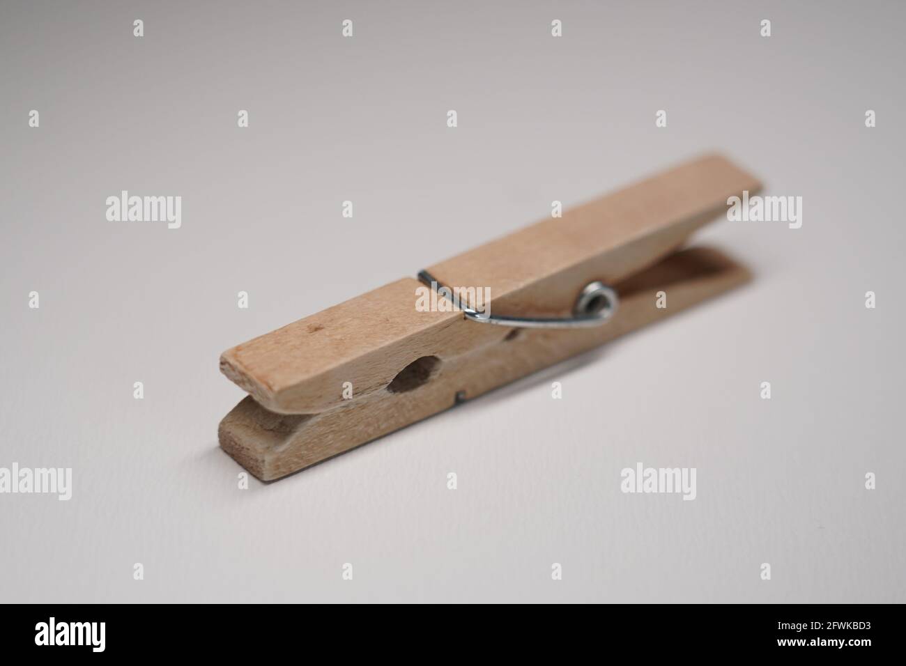 wooden clothes peg on a white background Stock Photo - Alamy