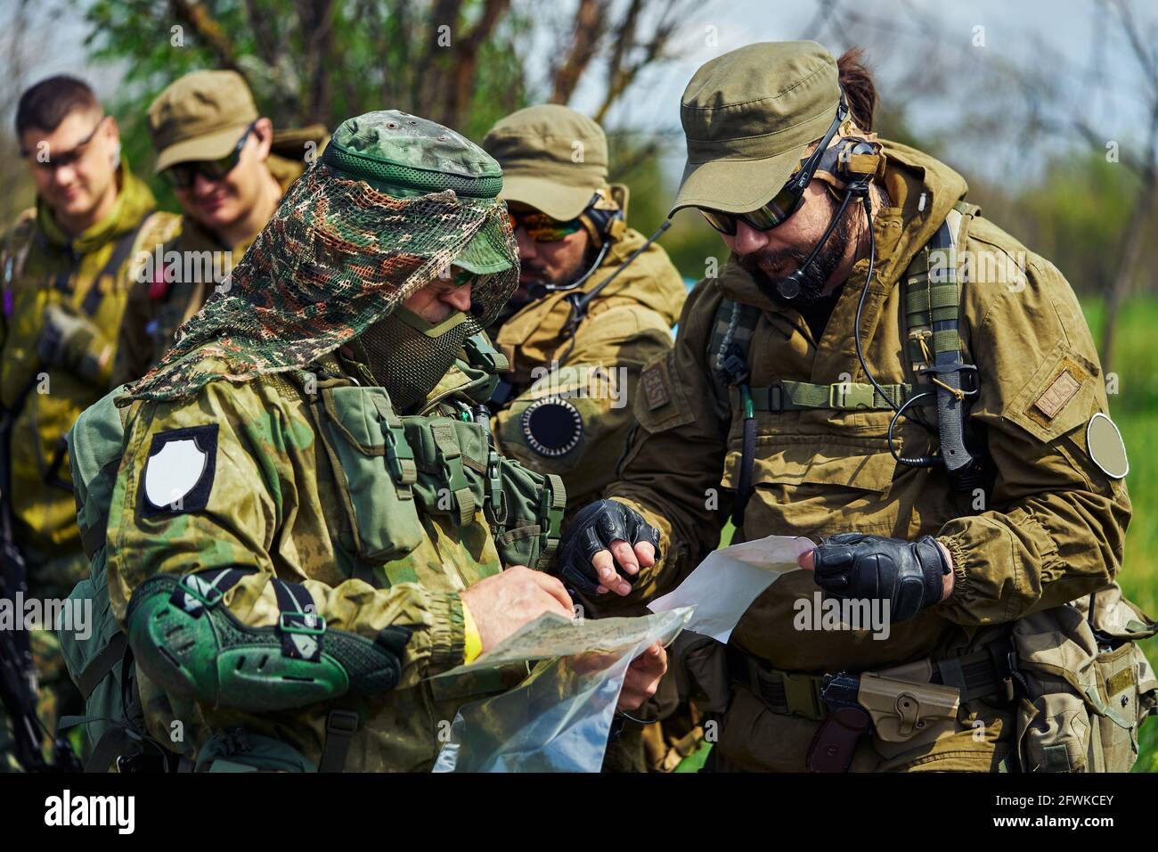 A group of airsoft players in the uniform of Russian soldiers are ...