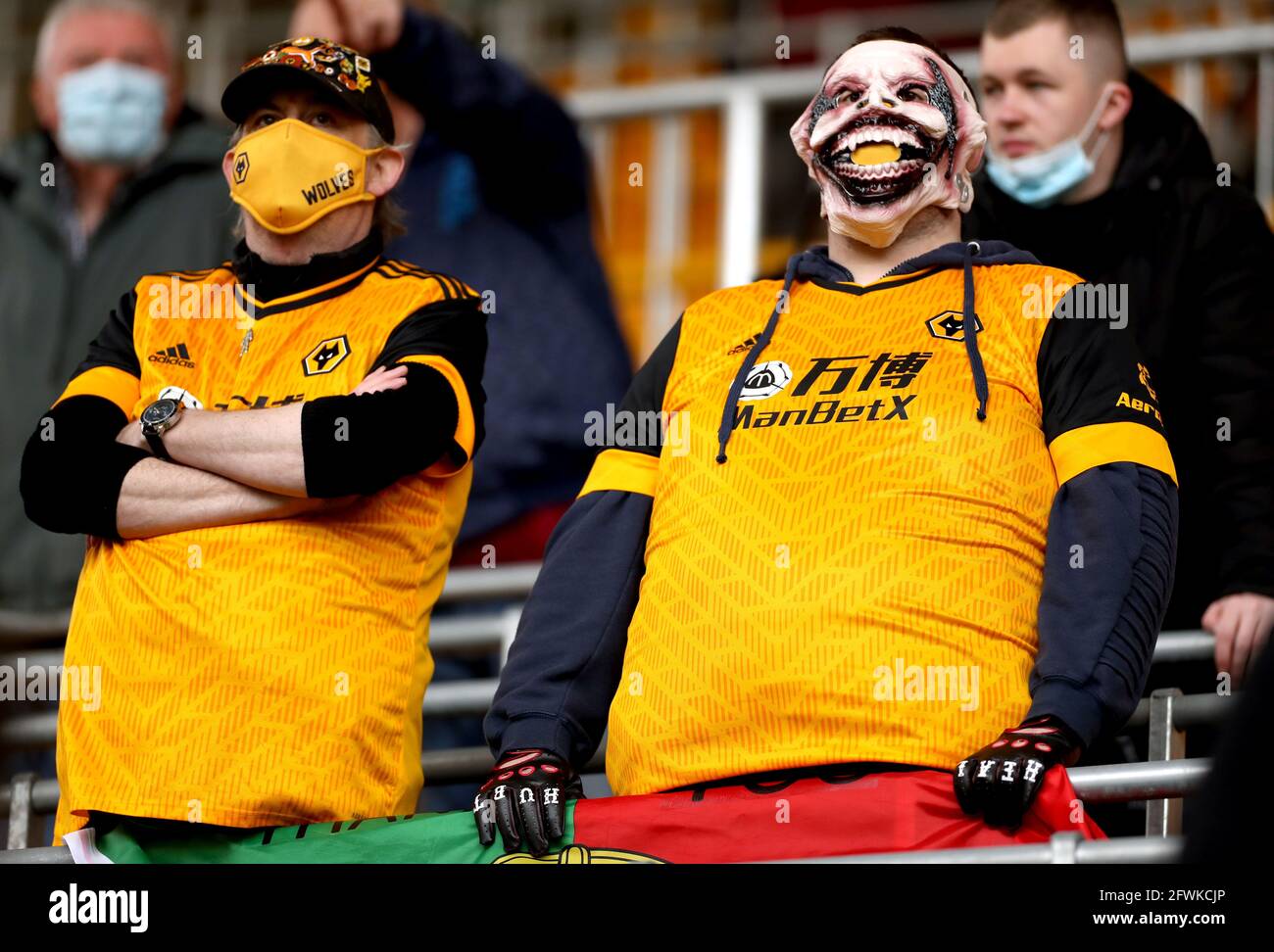 A Wolverhampton Wanderers fan wears a mask in the stands ahead of the ...