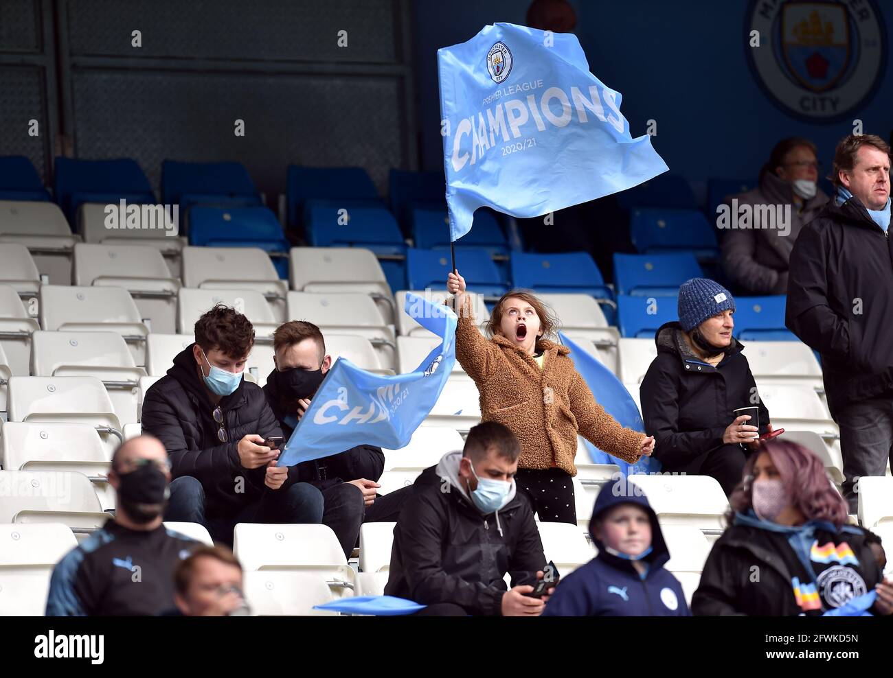 Manchester City fans wave champions flags in the stands during the ...