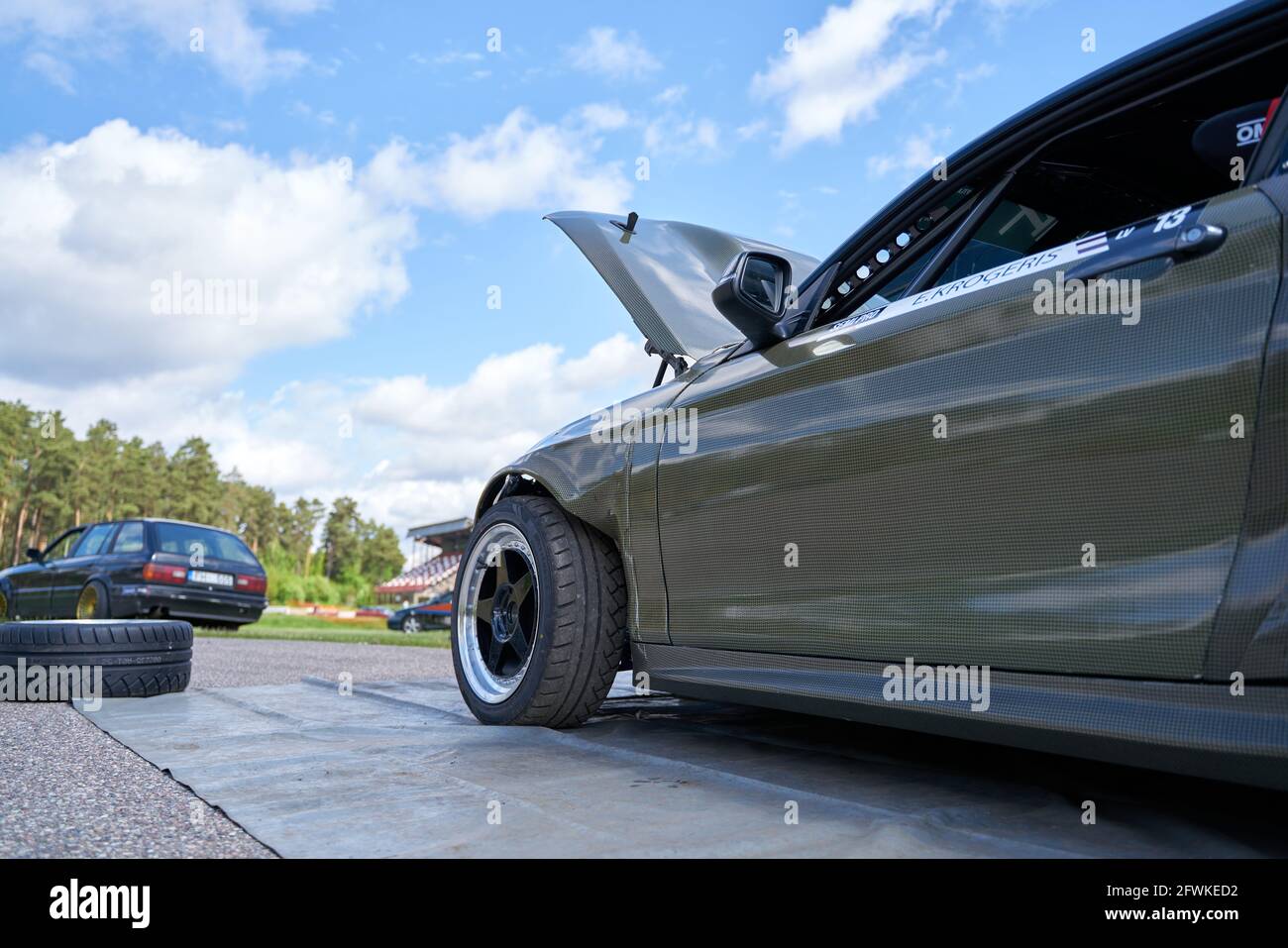 Rear side view front wheel of black car Stock Photo - Alamy