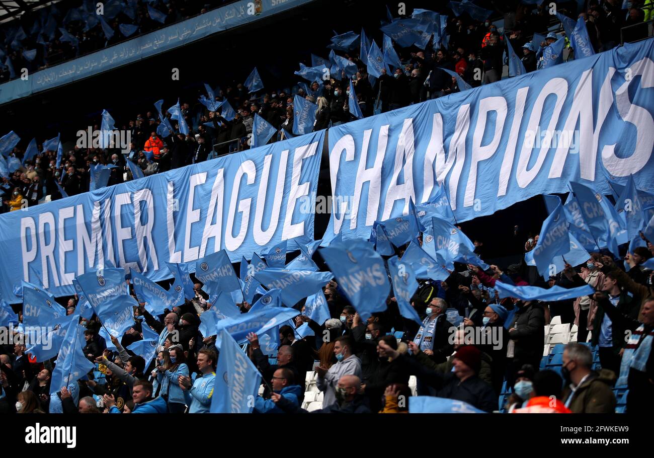 Manchester City fans wave champions flags in the stands during the ...