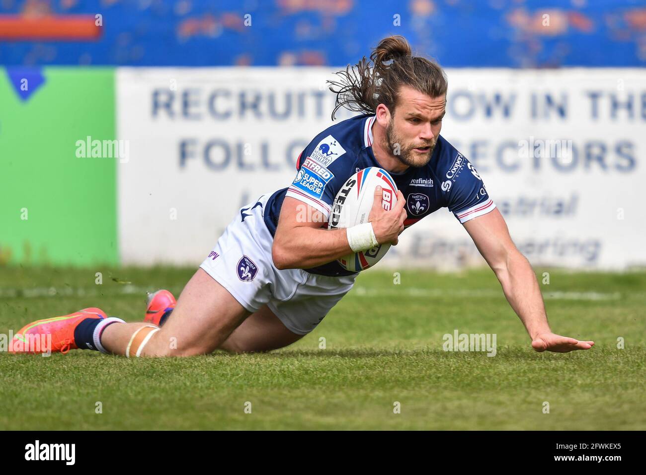 Liam Kay (5) of Wakefield Trinity celebrates his try with team mates ...