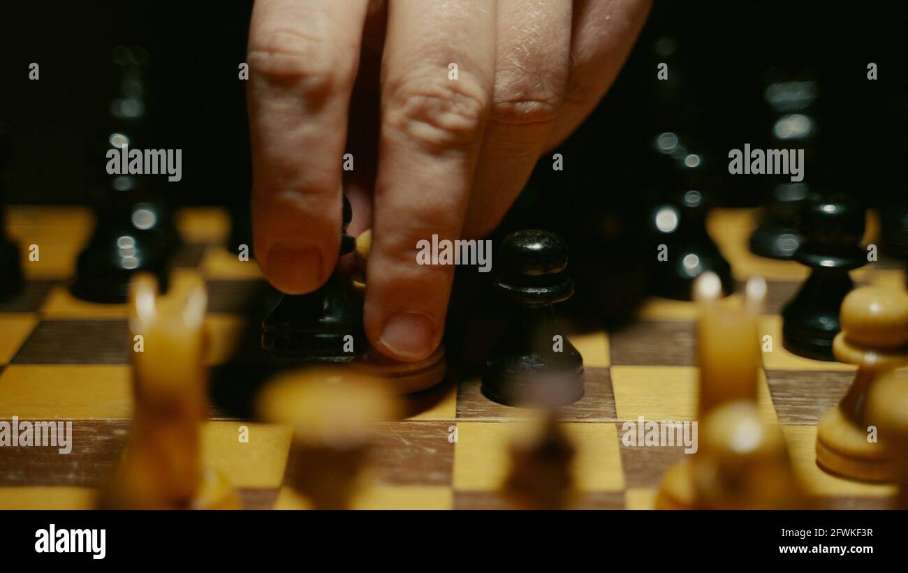 Person uses pawn on board hi-res stock photography and images - Alamy