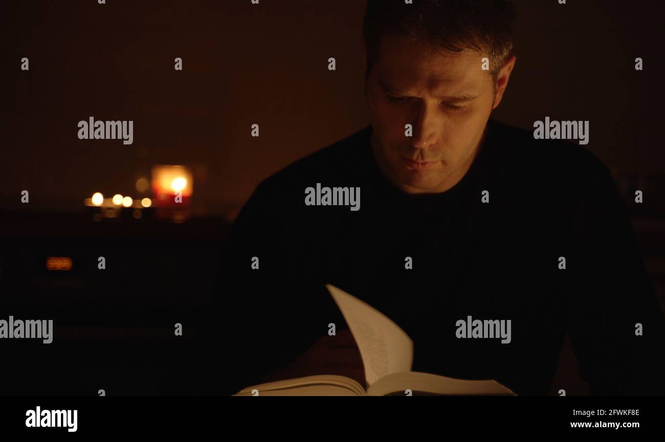 Reading candle man hi-res stock photography and images - Alamy