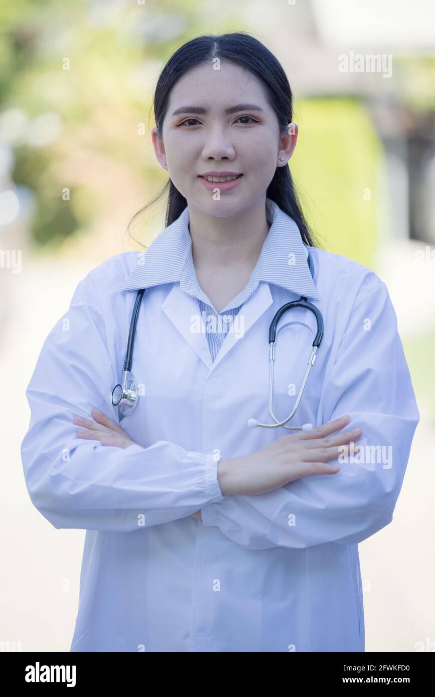 Portrait Of Female Doctor Standing Outside Hospital Stock Photo - Alamy
