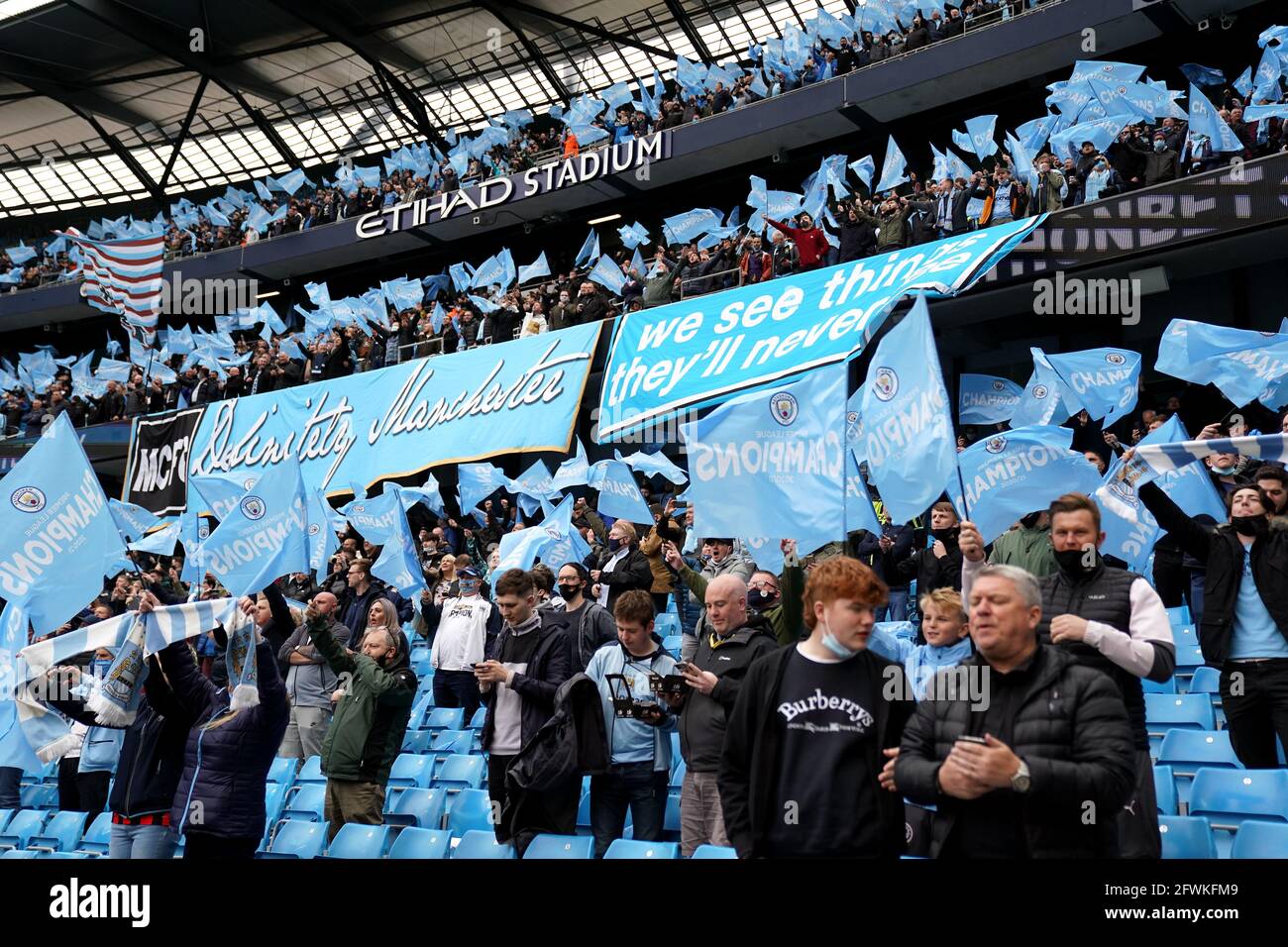 Manchester City fans wave champions flags during the Premier League ...