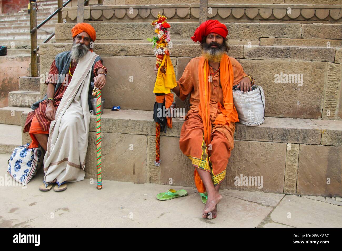 Sadhus sitting on the ghat steps in Varanasi, India Stock Photo - Alamy