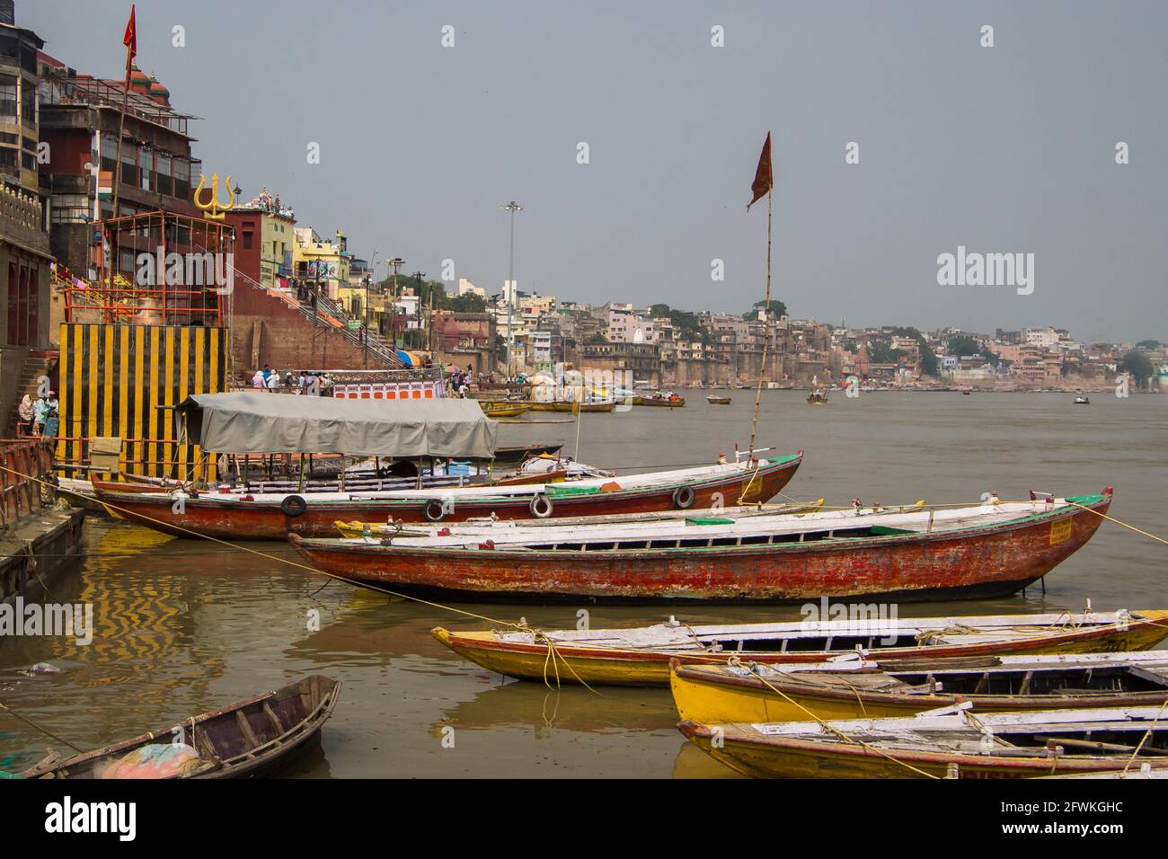 Colourful wooden boats line the banks of the River Ganges in Varanasi ...