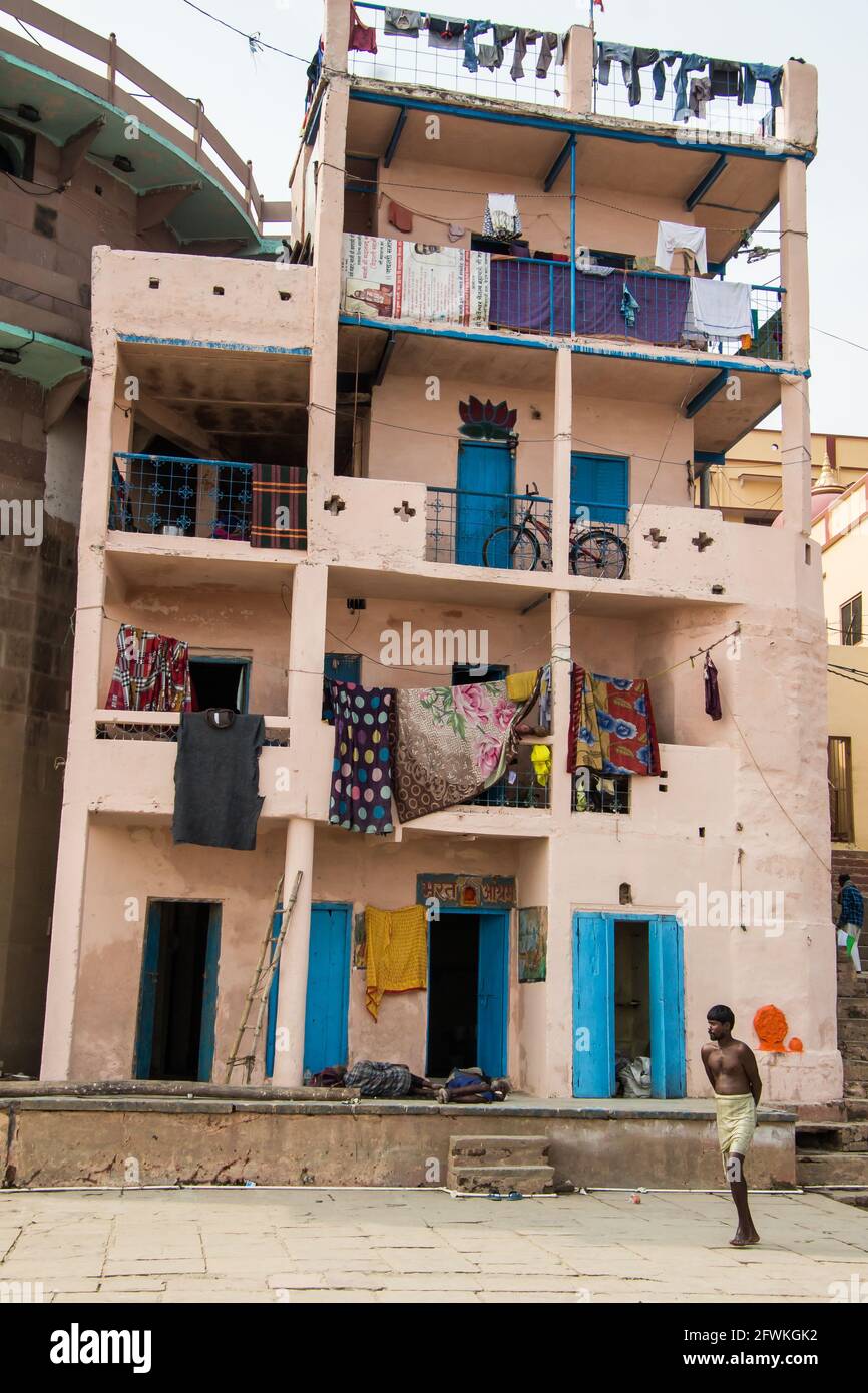 A colourful house on the banks of the River Ganges, Varanasi, India ...
