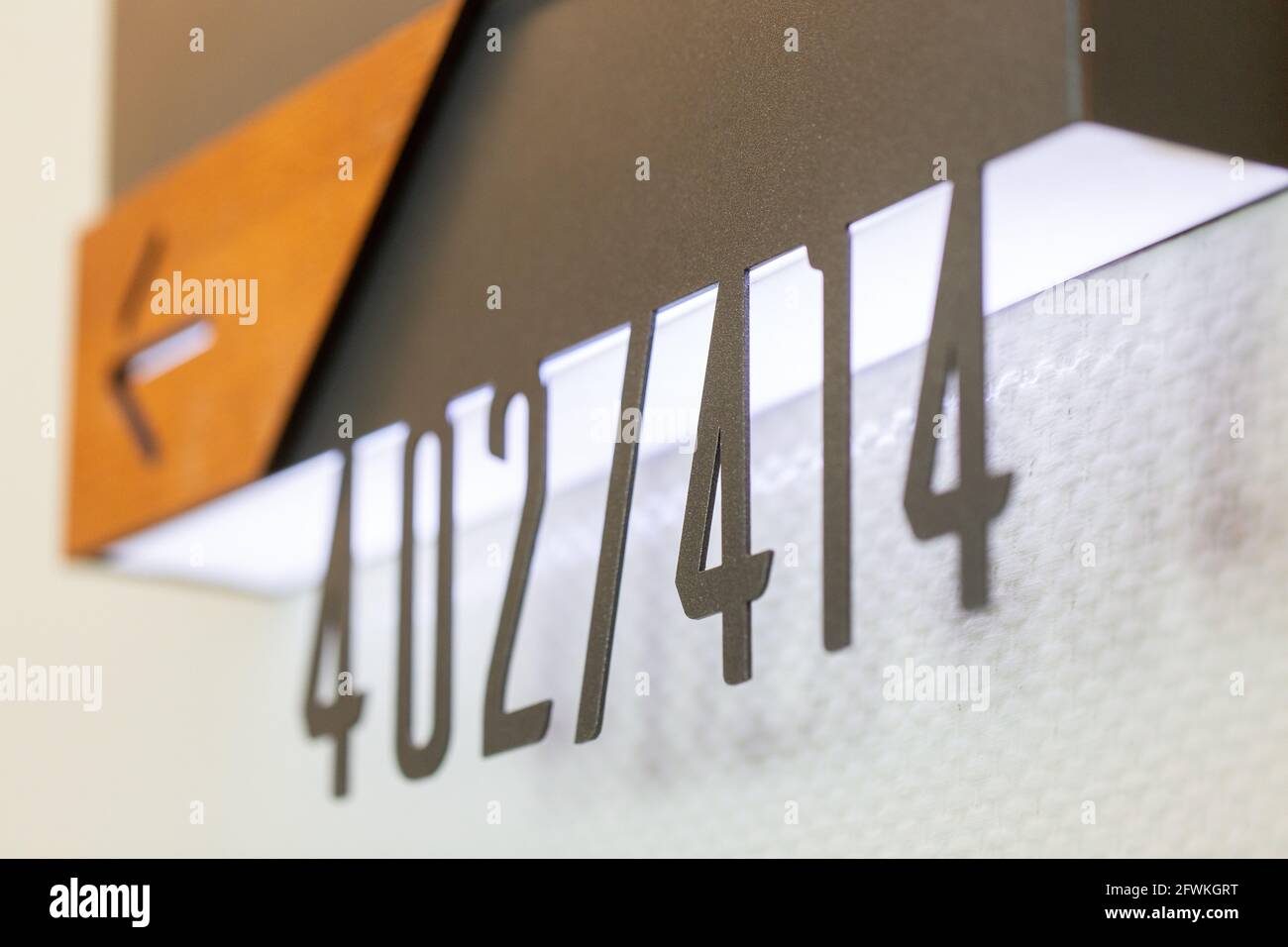Hotel room numbers "402 / 414" in the glass background Stock Photo - Alamy