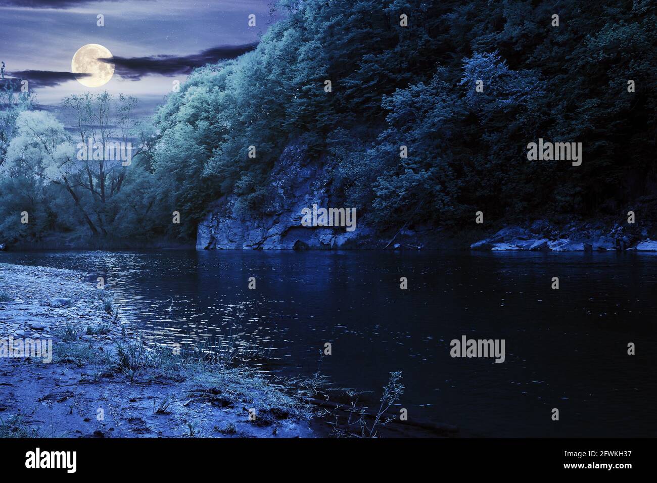 river flow under the rock at night. beautiful nature landscape in ...