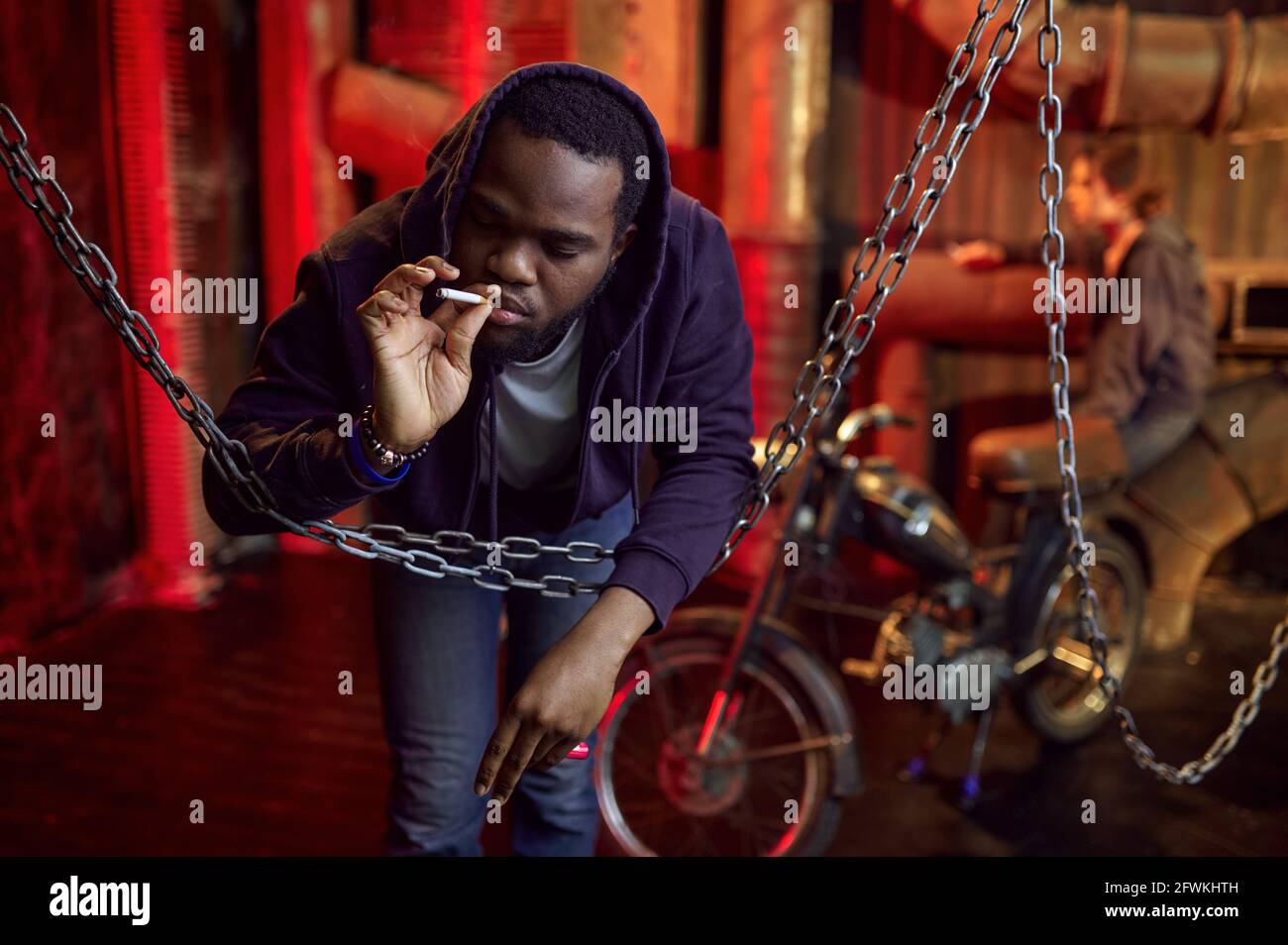 Lonely junkie smoking cigarette in hi-res stock photography and images ...