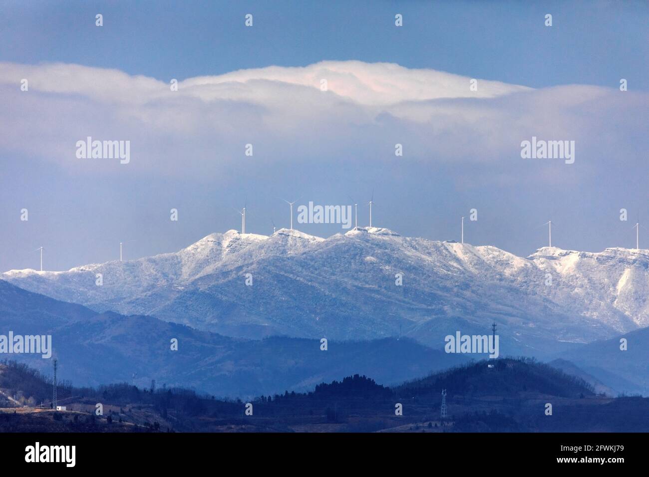 Snow mountain on the wind power station Stock Photo - Alamy