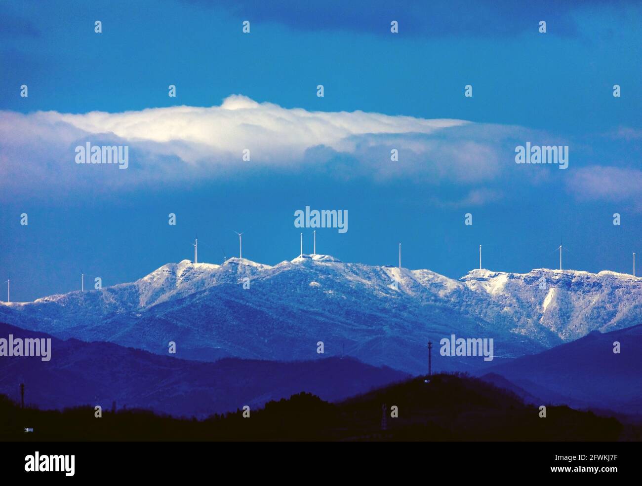 Snow mountain on the wind power station Stock Photo - Alamy