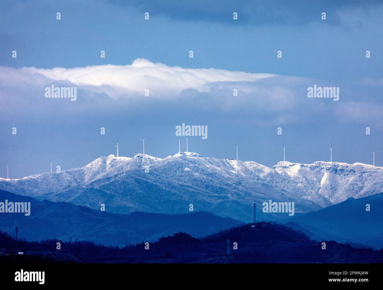 Snow mountain on the wind power station Stock Photo - Alamy