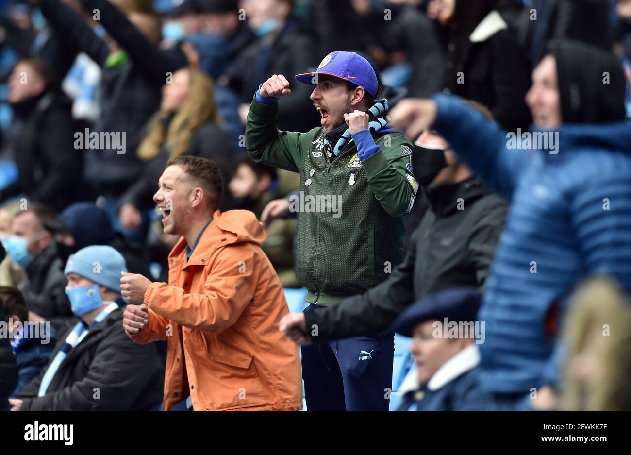 Manchester City fans in the stands celebrate their second goal during ...