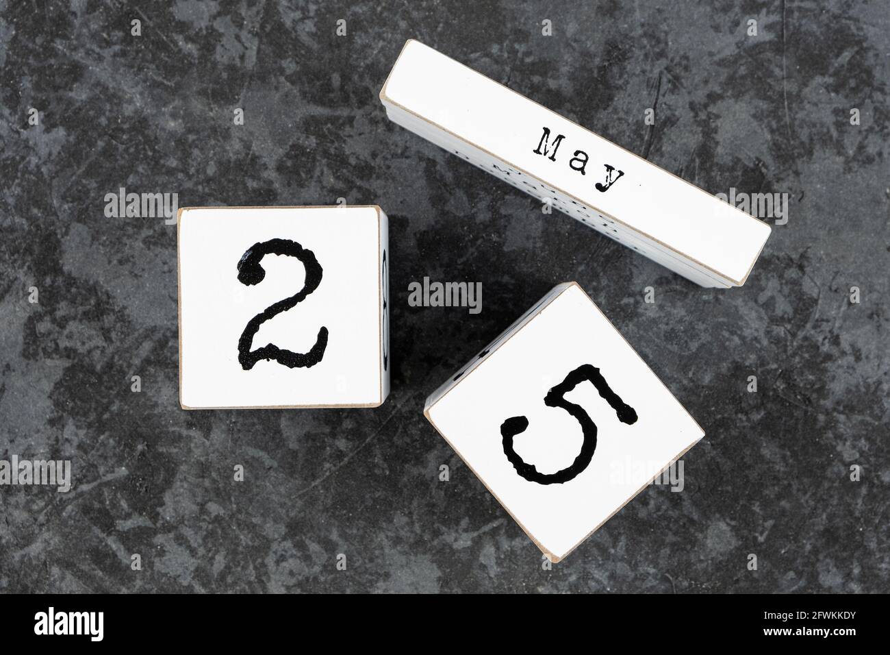 May 25th. May 25 white wooden cube calendar on grey grunge concrete ...