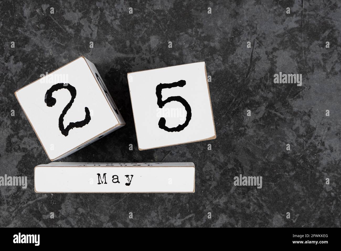 May 25th. May 25 white wooden cube calendar on grey grunge concrete ...