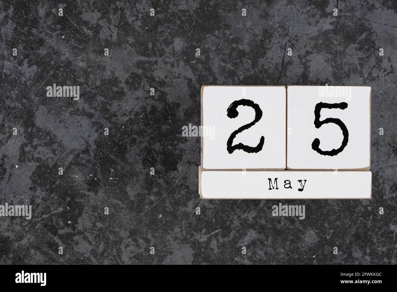 May 25th. May 25 white wooden cube calendar on grey grunge concrete ...